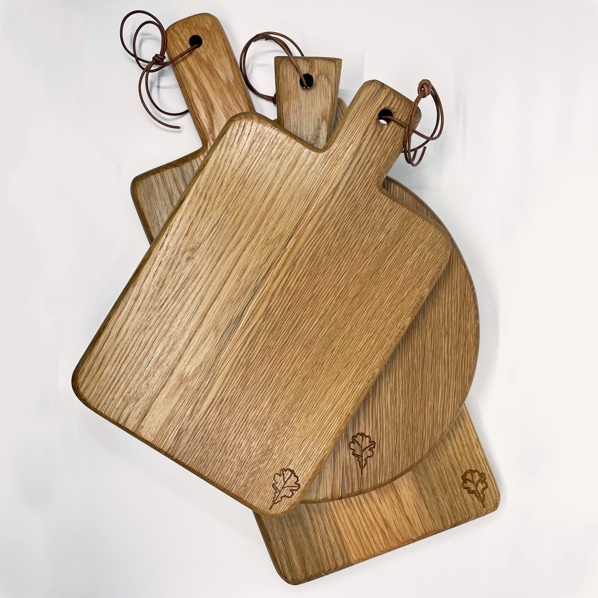 Grande planche en bois ronde avec manche – l'empreinte coopérative